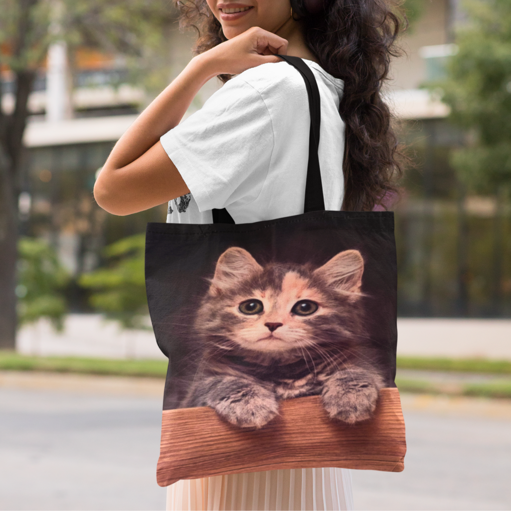 Cat Looking Over Wall Tote Bag